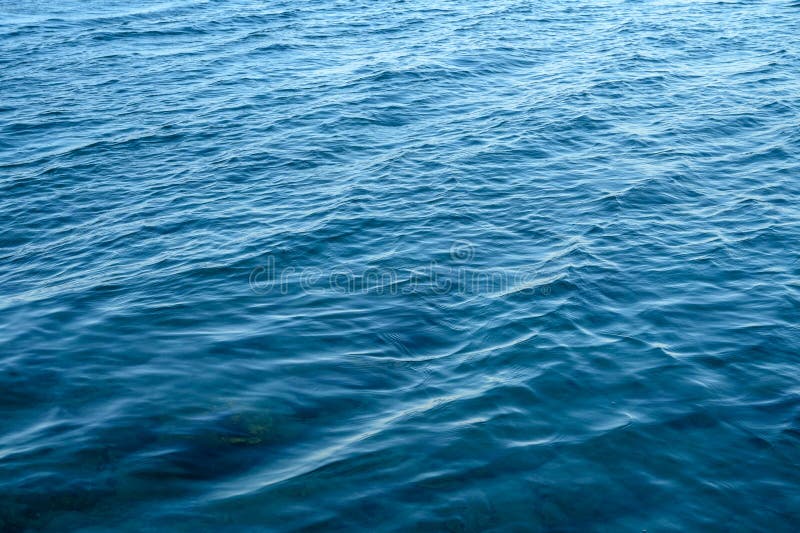 Water Peacefully Rippling during the Day Stock Image - Image of splash ...