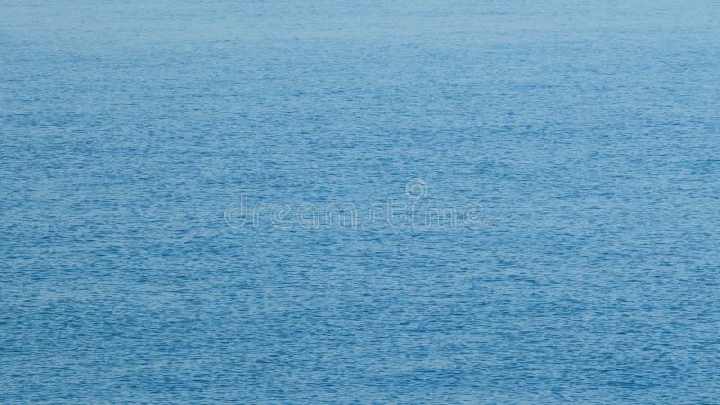 Blue Sea Water in Calm. Beautiful Wave Pattern in Sea. Still Calm Sea ...