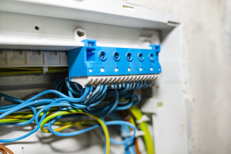 Neutral Bus Connected by Blue Wires Closeup Against Automatic Circuit ...