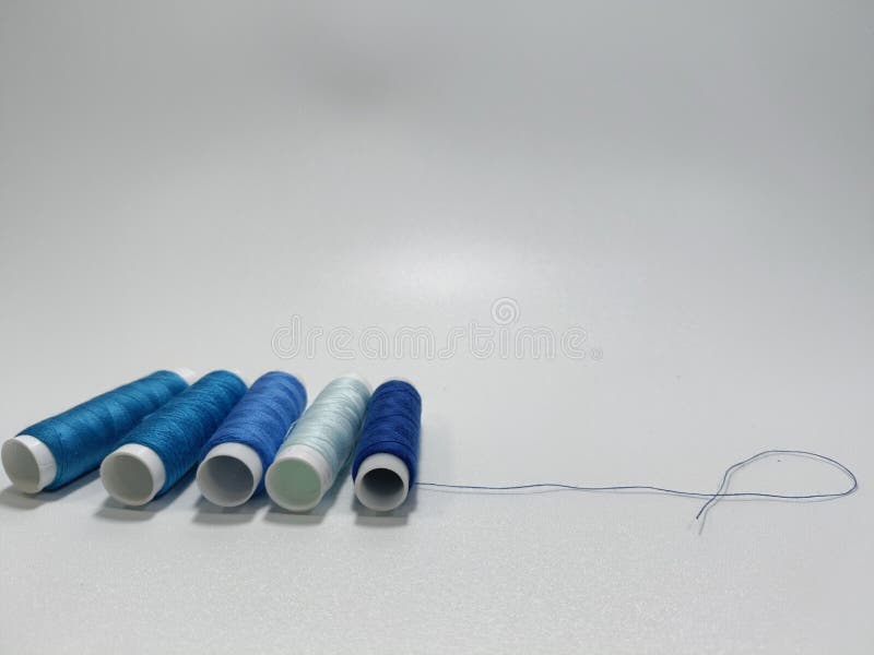 Blue Sewing Thread Spools Unraveled White Background Stock Photos ...
