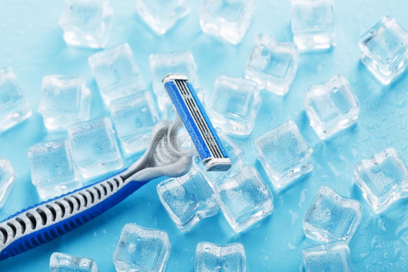 Blue Shaving Machine with Sharp Blades on the Background of Ice Cubes ...