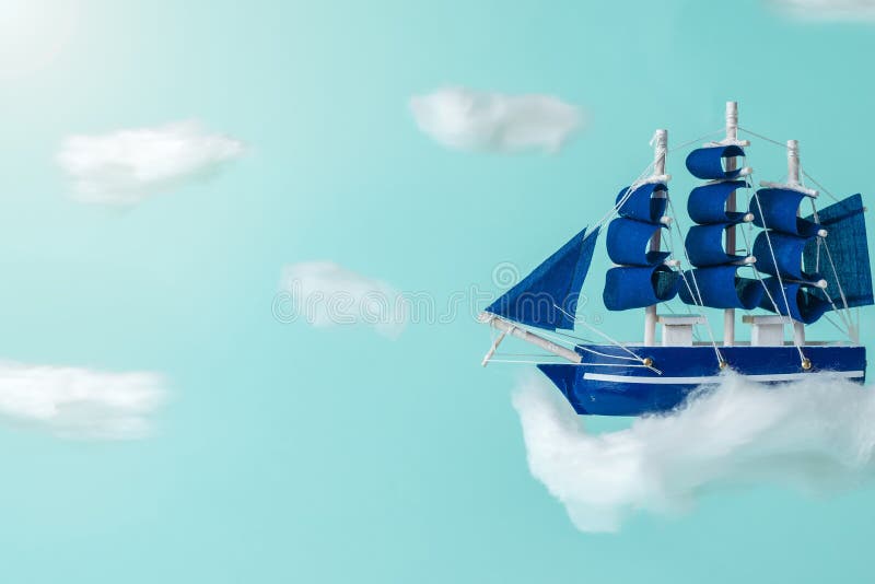 A Blue Ship with Sails Flying in the Clouds Stock Image - Image of ...