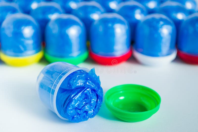 Blue Shoe Covers in Individual Capsules with Multi-colored Caps ...