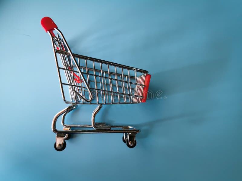 Blue shopping cart. stock photo. Image of cash, close - 183832962