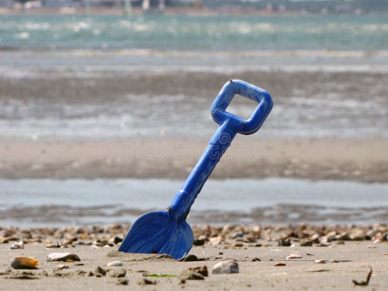 Blue Shovel in the Sea Sand Stock Photo - Image of games, objects: 14927356