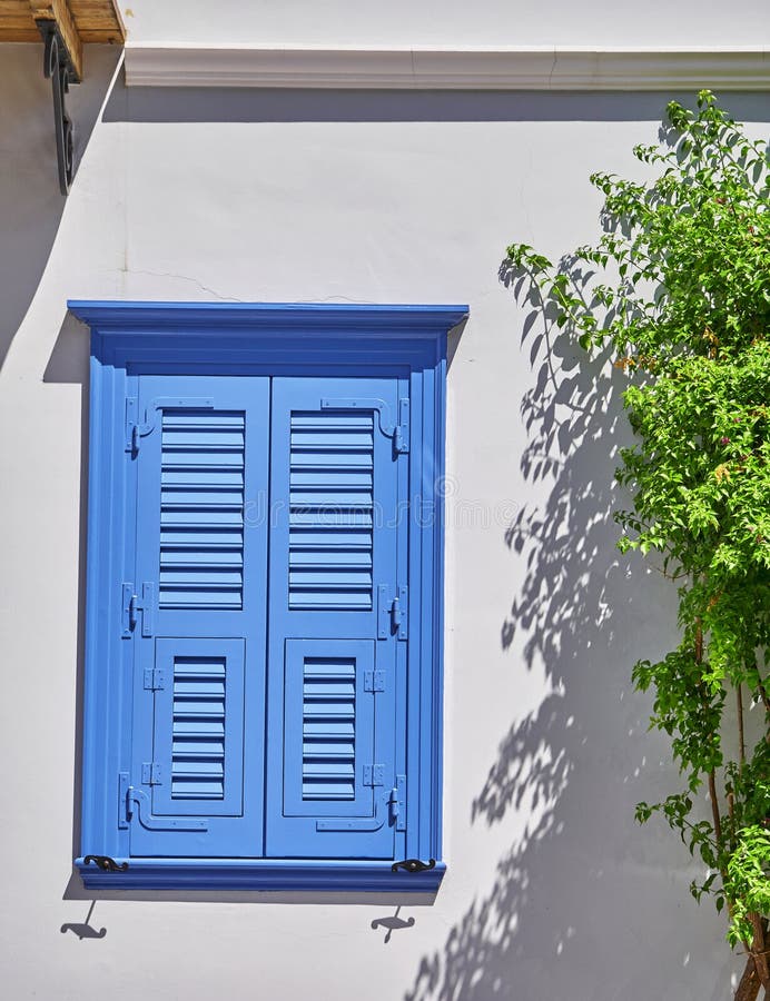 Blue Shutters on White Wall Stock Image - Image of style, building ...