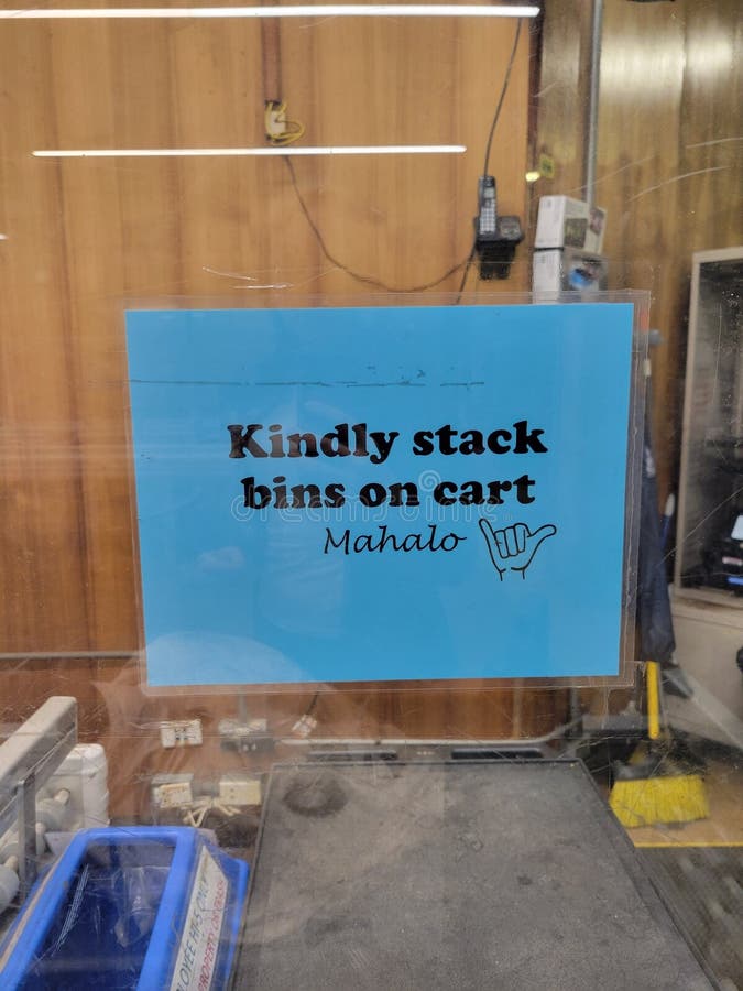 A Blue Sign that Says Kindly Stack Bins on Cart Stock Image - Image of ...