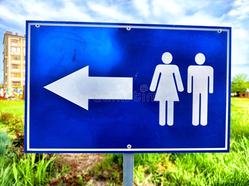 Blue Sign Showing Man Woman Arrow Left Stock Photos - Free & Royalty ...