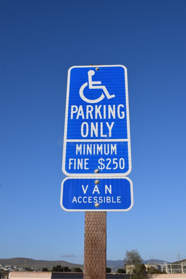A Blue Sign with the Writing Parking only, Minimum Fine $250, Van ...