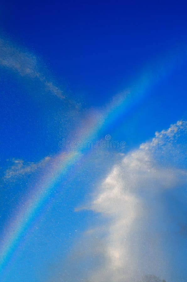 Blue skies and rainbows stock image. Image of rainbow - 26029949