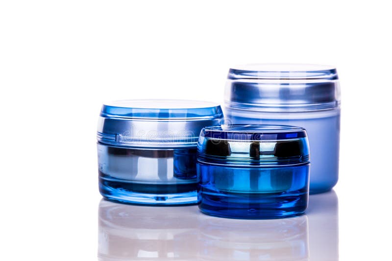 Blue Skincare Bottle and Lavender Flowers on a Blue Silk Cloth Stock ...