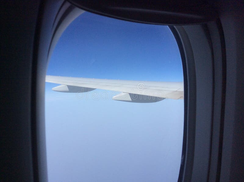 Blue Sky and Airplane Wing Seen from Airplane Window Stock Image ...