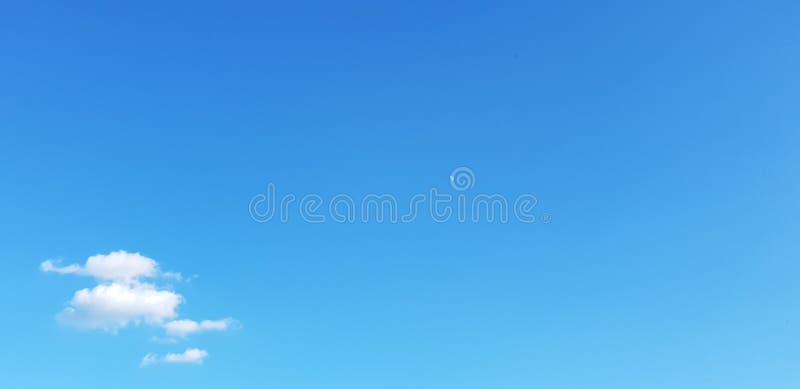 Blue Sky Background with a Small Group of Tiny Clouds Stock Photo ...
