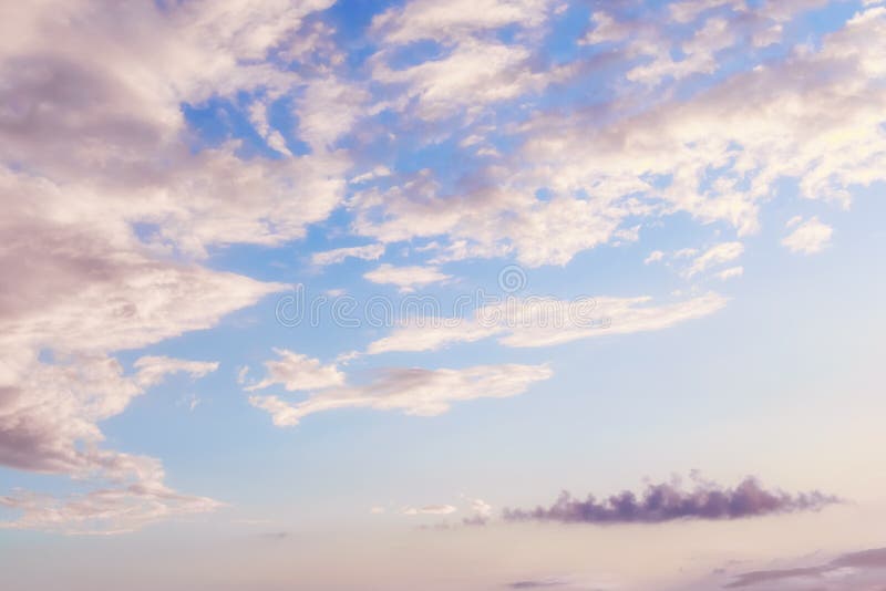 Blue Sky with Beautiful White Fluffy Clouds in Pink Shades Stock Photo ...