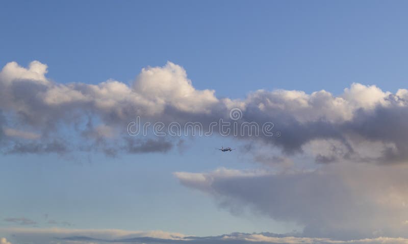 Cloudy Background with a Airplane in the Distance Stock Image - Image ...
