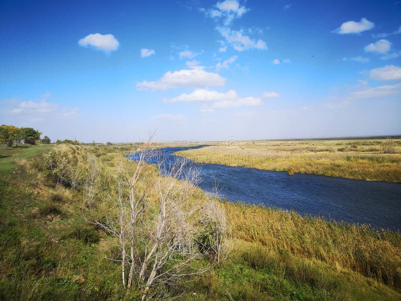 Blue Sky, Bright Blue Water Stock Photo - Image of hill, reflection ...