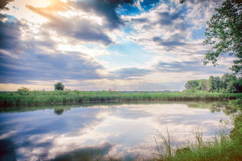 The Blue Sky with the Clouds Above the Clear Blue Lake Stock Image ...