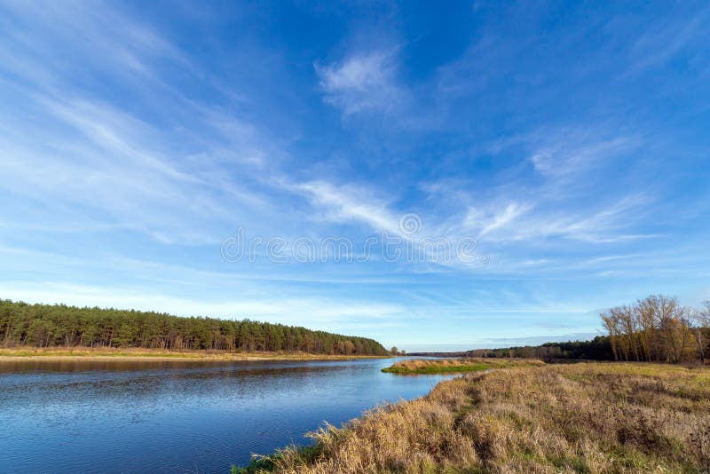 The Blue Sky with the Clouds Above the Clear Blue River Stock Image ...