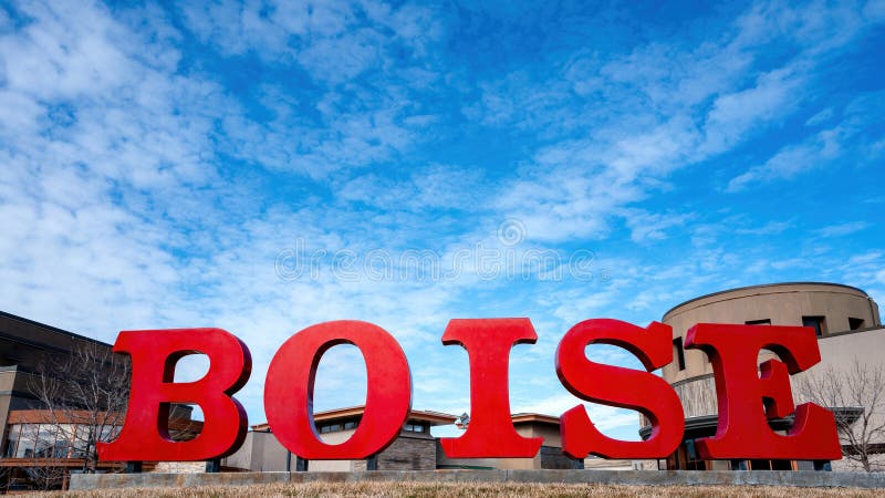 Blue Sky with Clouds Above a Red Boise Sign Editorial Stock Photo ...