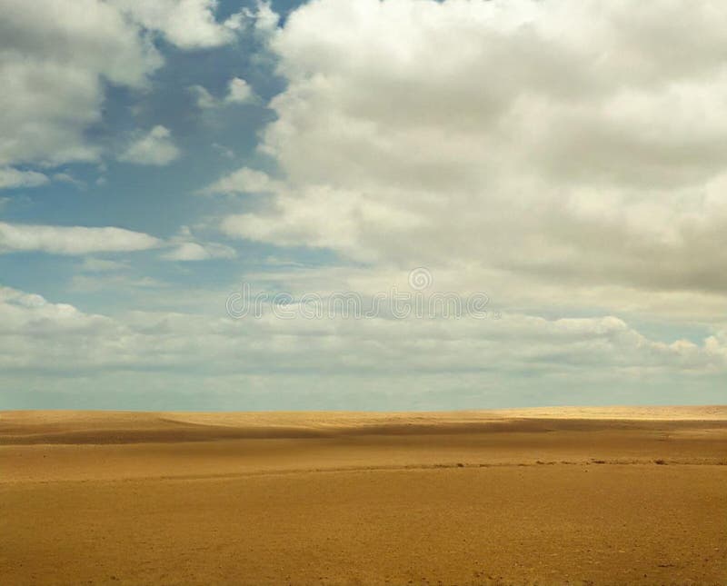 Blue Sky with Clouds Over Desert Landscape with Sand Dunes Stock Photo ...
