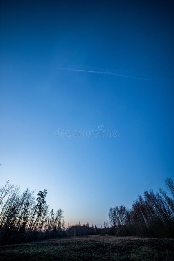 Blue Sky with Clouds and Plane Trails Stock Photo - Image of sunbeam ...
