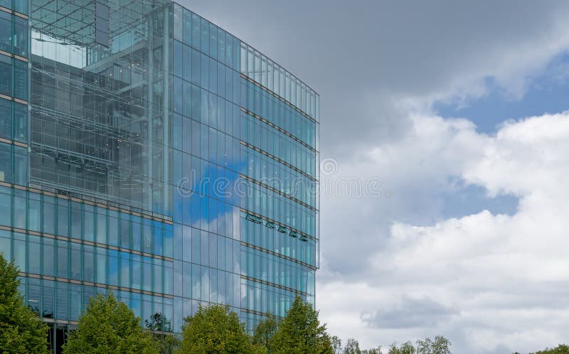 Blue Sky and Clouds Reflecting in the Windows of an Office Building ...