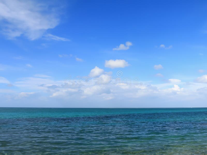 Blue Sky and Clouds in the Blue Sea Stock Image - Image of blue, ocean ...