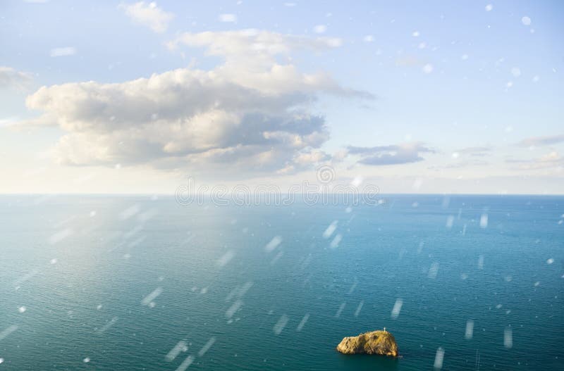 Blue Sky with Clouds and Snowfall Over Sea Stock Photo - Image of ...