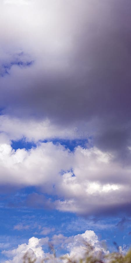 Blue Sky with Clouds and Sun. Vertical Format. Stock Photo - Image of ...