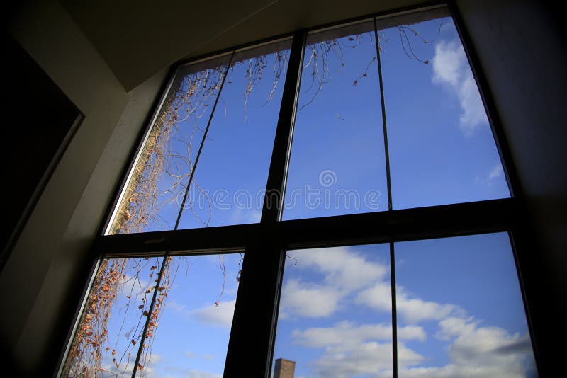 Blue Sky and Clouds through a Window of a Building Stock Photo - Image ...
