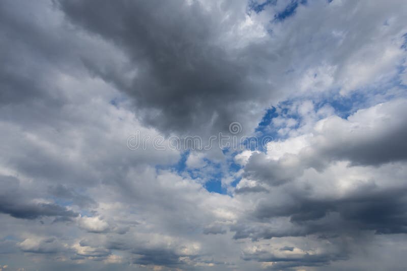Blue sky with dense clouds stock image. Image of blue - 218645137