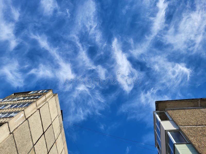 Blue Sky with Fluffy Feathery Clouds and the Edge of the Facade of a ...