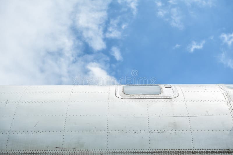 Blue Sky Frame the Aircraft Exterior of Airplane Fuselage with Visible ...