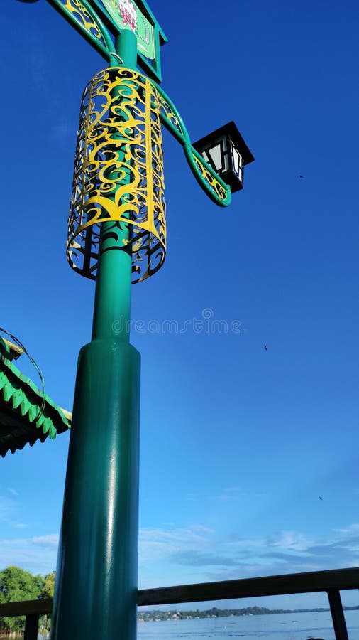Blue Sky with Green and Yellow Lampposts Stock Image - Image of yellow ...