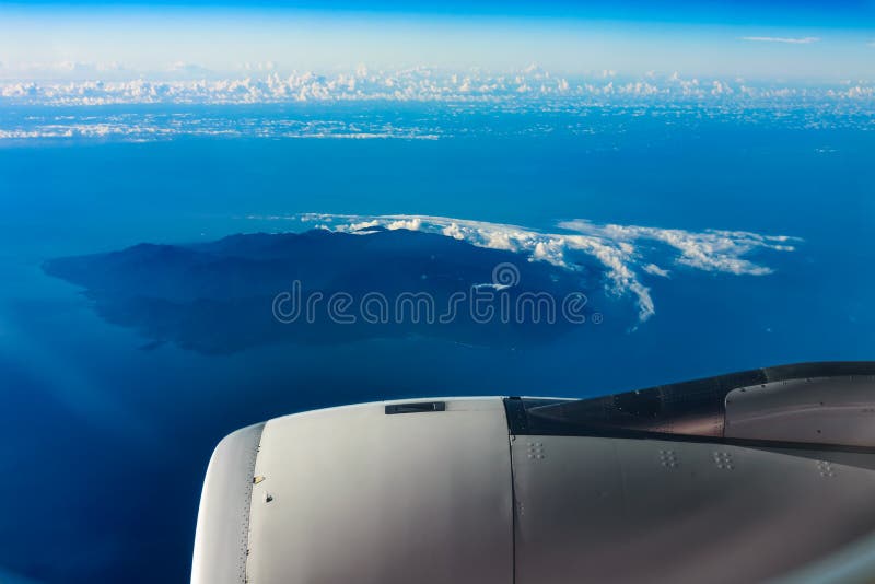 Passenger View through the Window of a Jet Plane Showing Sky, Clouds ...