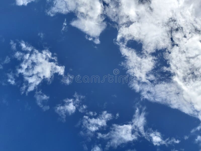 Blue Sky with Little Clouds Moving Around Stock Photo - Image of lovely ...