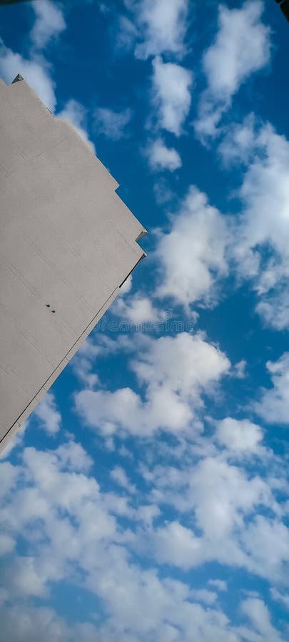 Blue Sky with Lots of Clouds Taken from the Gap in a Tall Building ...