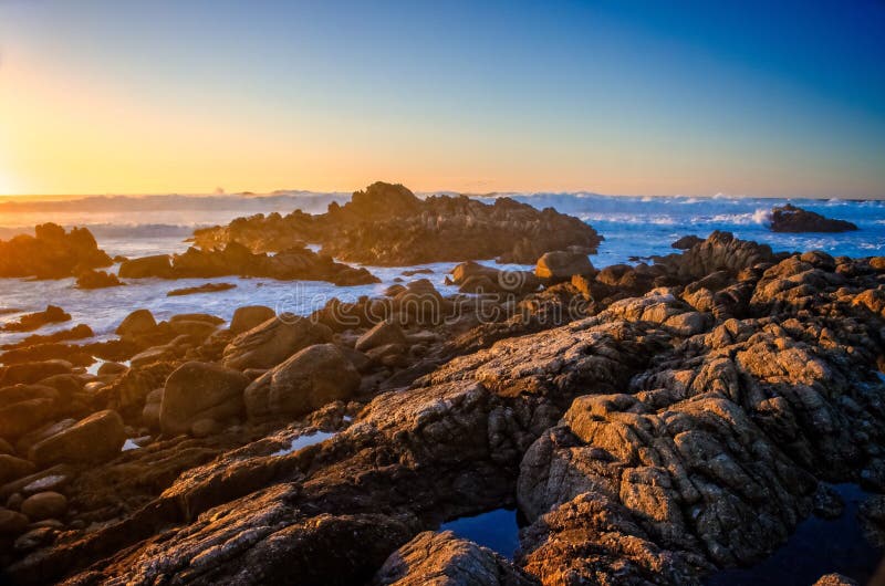 Blue sky ocean rocks stock photo. Image of waves, rocks - 63754804