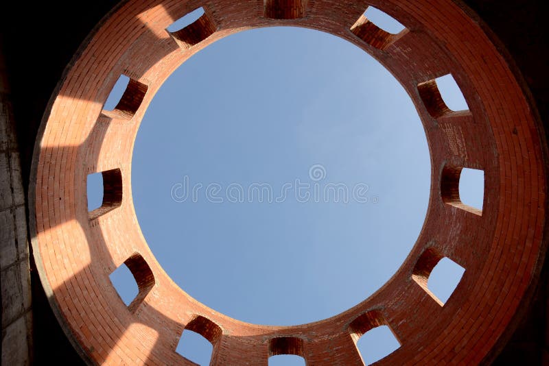 Blue Sky in the Open Roof Under Construction. Round Frame Made of Brick ...