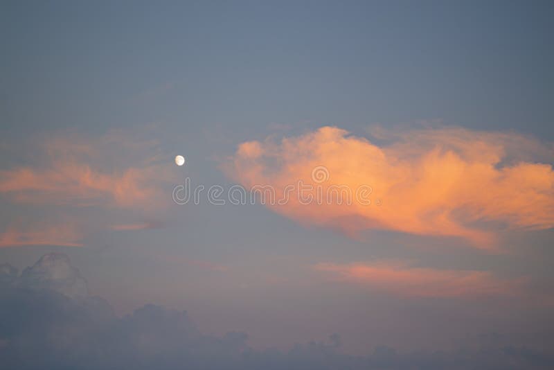 Blue Sky and Orange Clouds. Sunset Sky with the Moon, the Clouds are ...