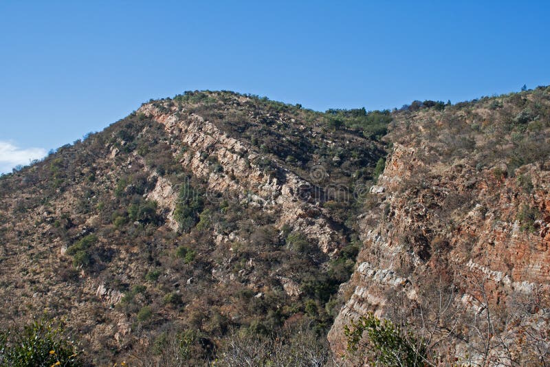 DIAGONAL STREAKS of ROCK RUNNING through the SIDE of a HILL Stock Photo ...