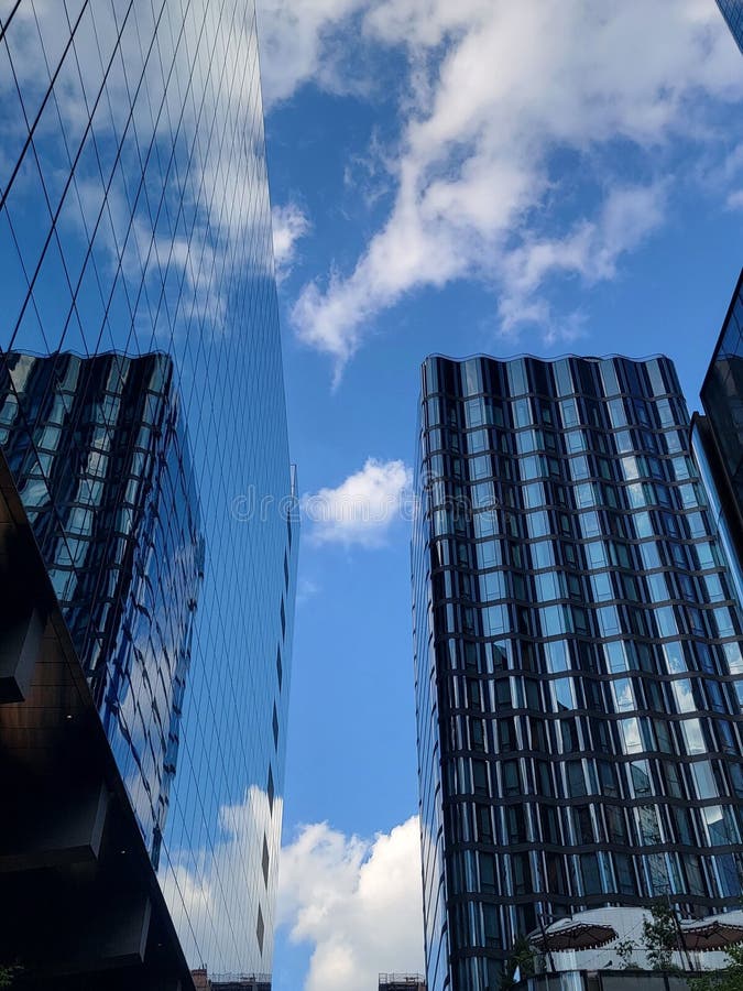 Blue Sky Reflecting on Building S Windows. Stock Photo - Image of ...