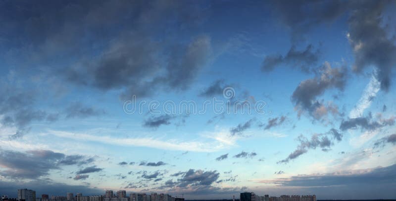 Blue Sky Panorama with Clouds Over Tops of Buildings Stock Photo ...