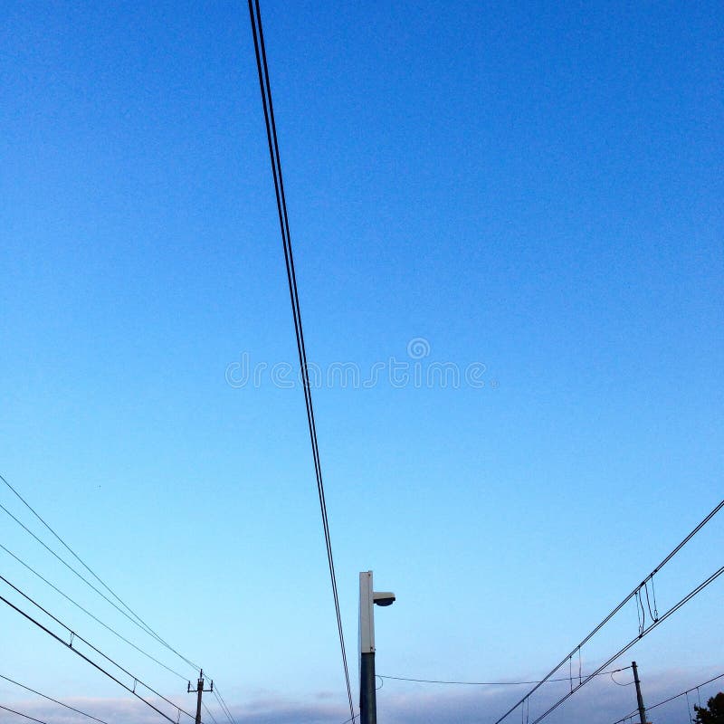 Blue sky and power cables stock image. Image of transmission - 57024325
