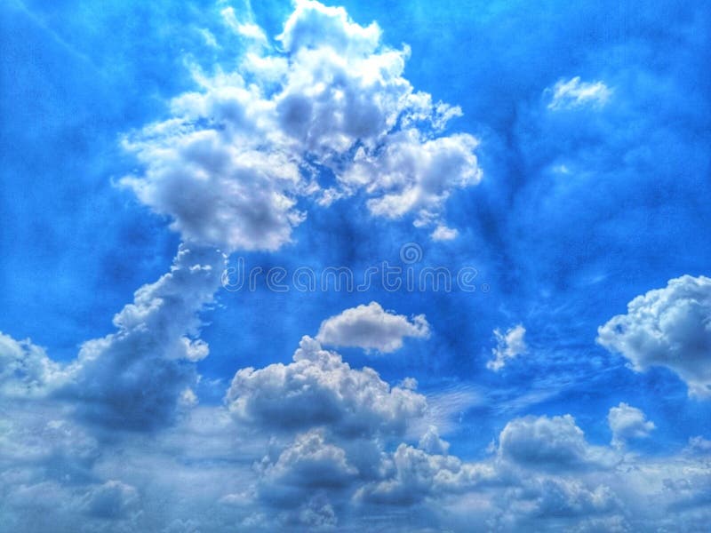 Blue Sky and Puffy Clouds. a Horizontal Shot of Bright Blue Sky with ...
