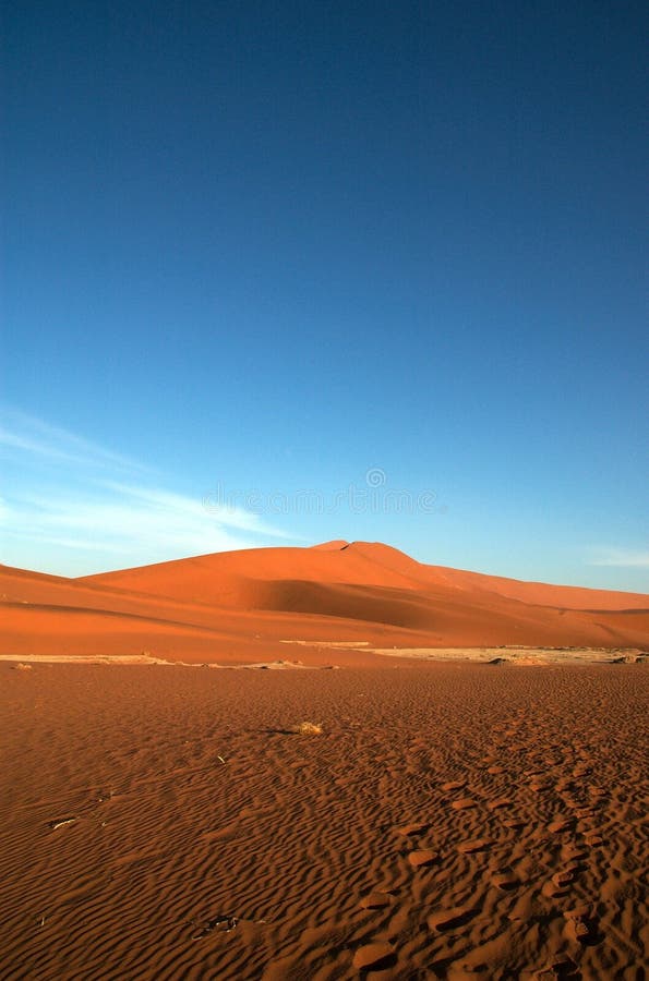 Blue sky and red sand stock photo. Image of activities - 1005216