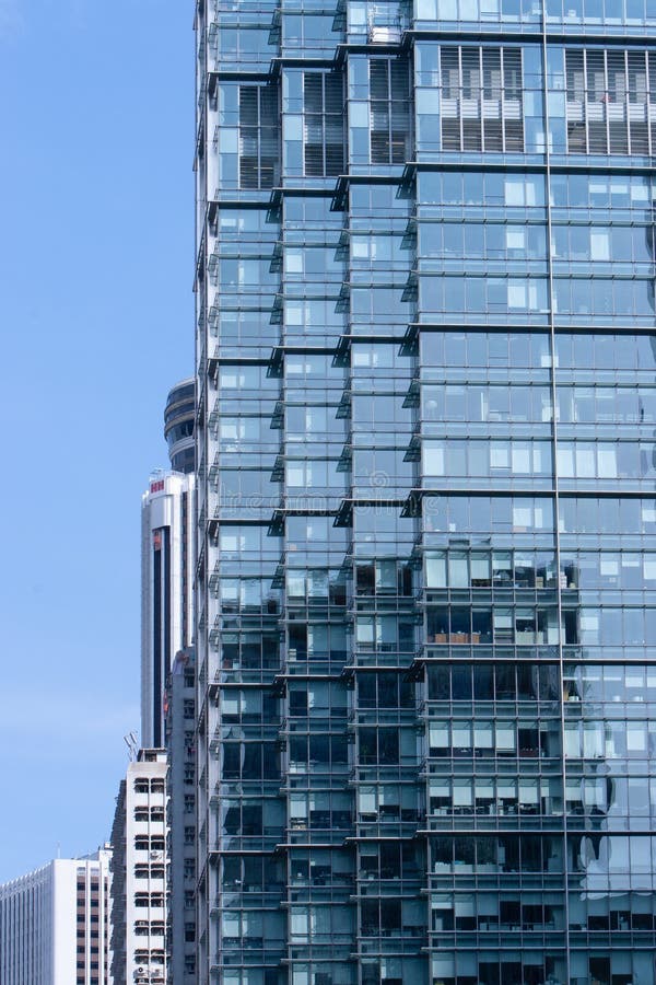 Blue Sky Reflected in Windows of Modern Office Building Stock Photo ...