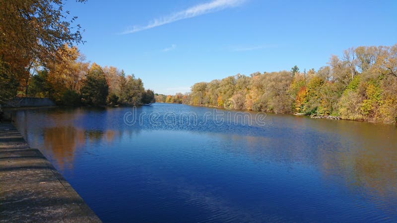 Blue Sky Blue River Waters with Autumn Colors Stock Photo - Image of ...