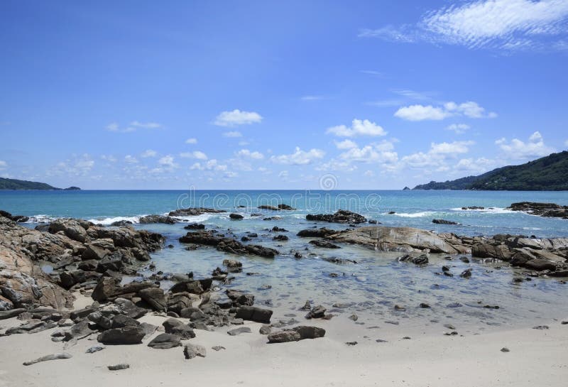 Blue sky and rock on beach stock photo. Image of coast - 10868992