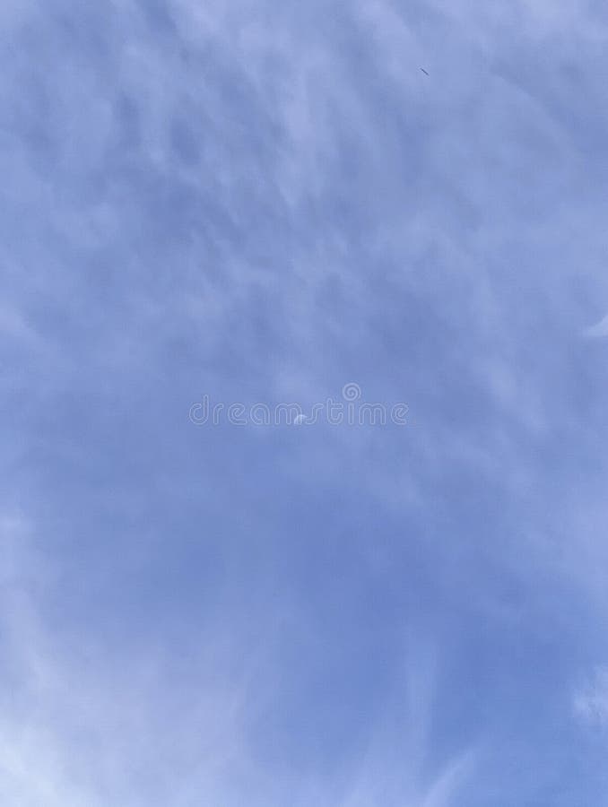 Blue Sky with a Small Moon at the Center of the Image Stock Photo ...